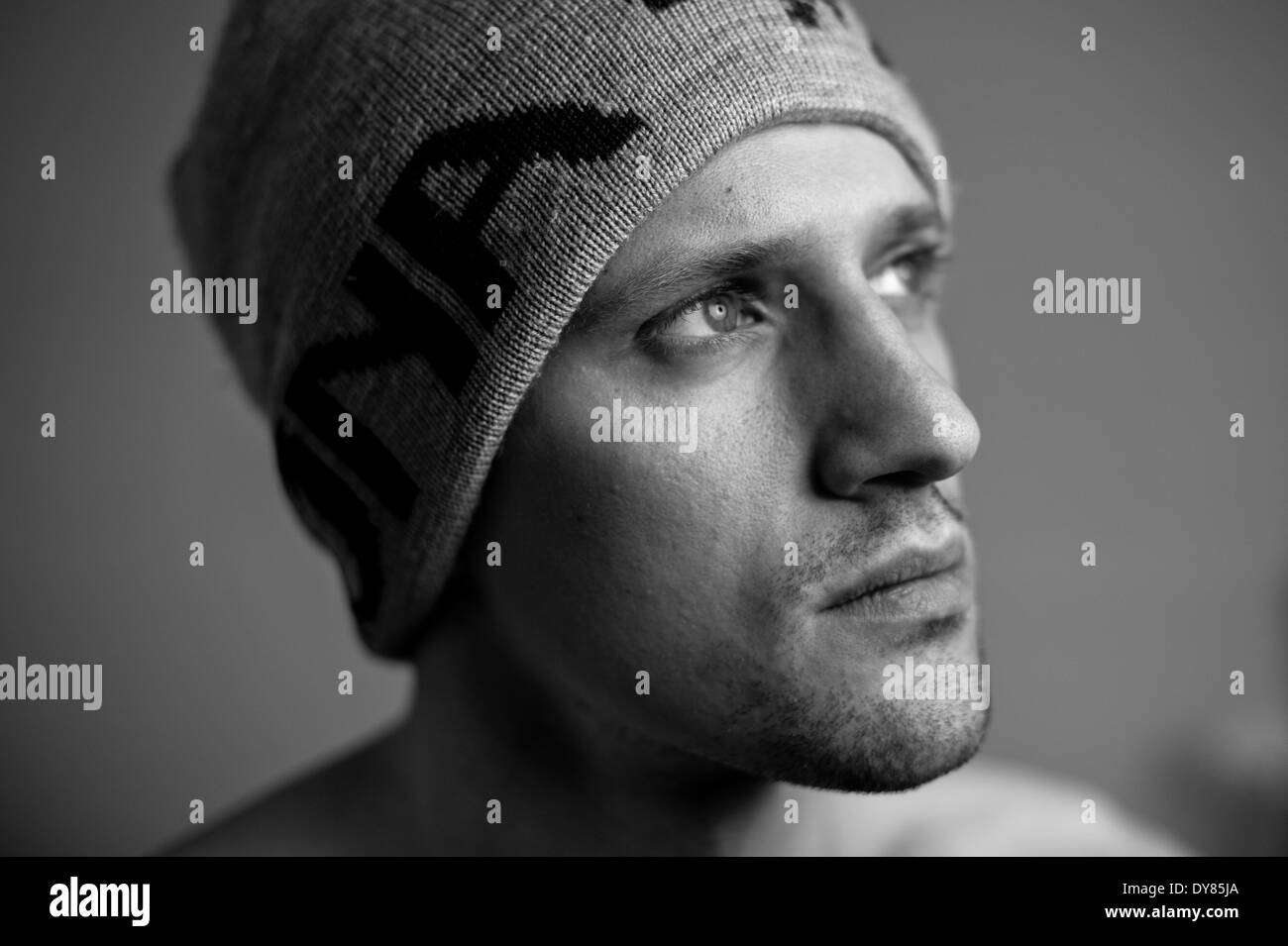 Pondering young man hi-res stock photography and images - Alamy