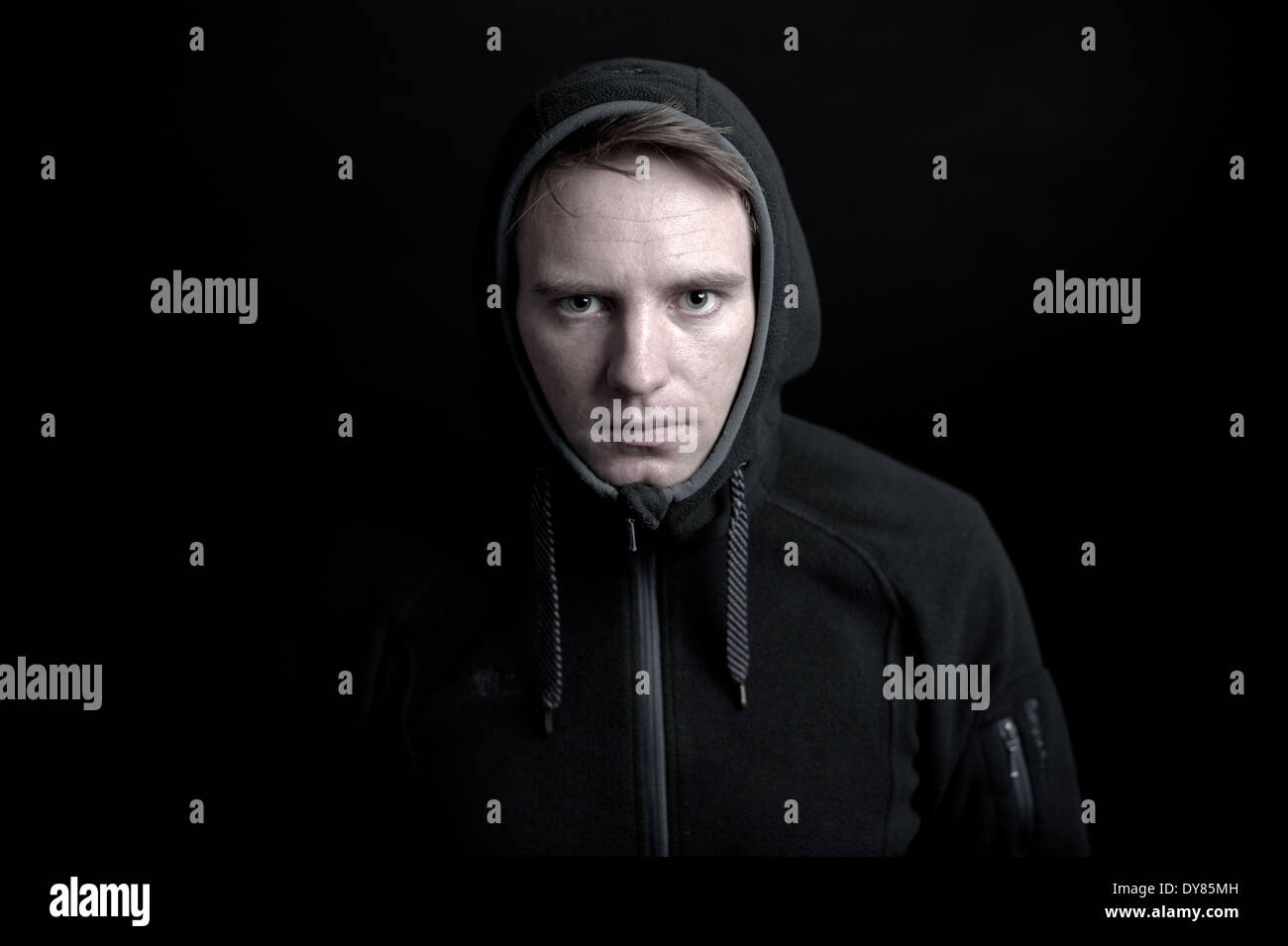 Young man with hood Stock Photo - Alamy