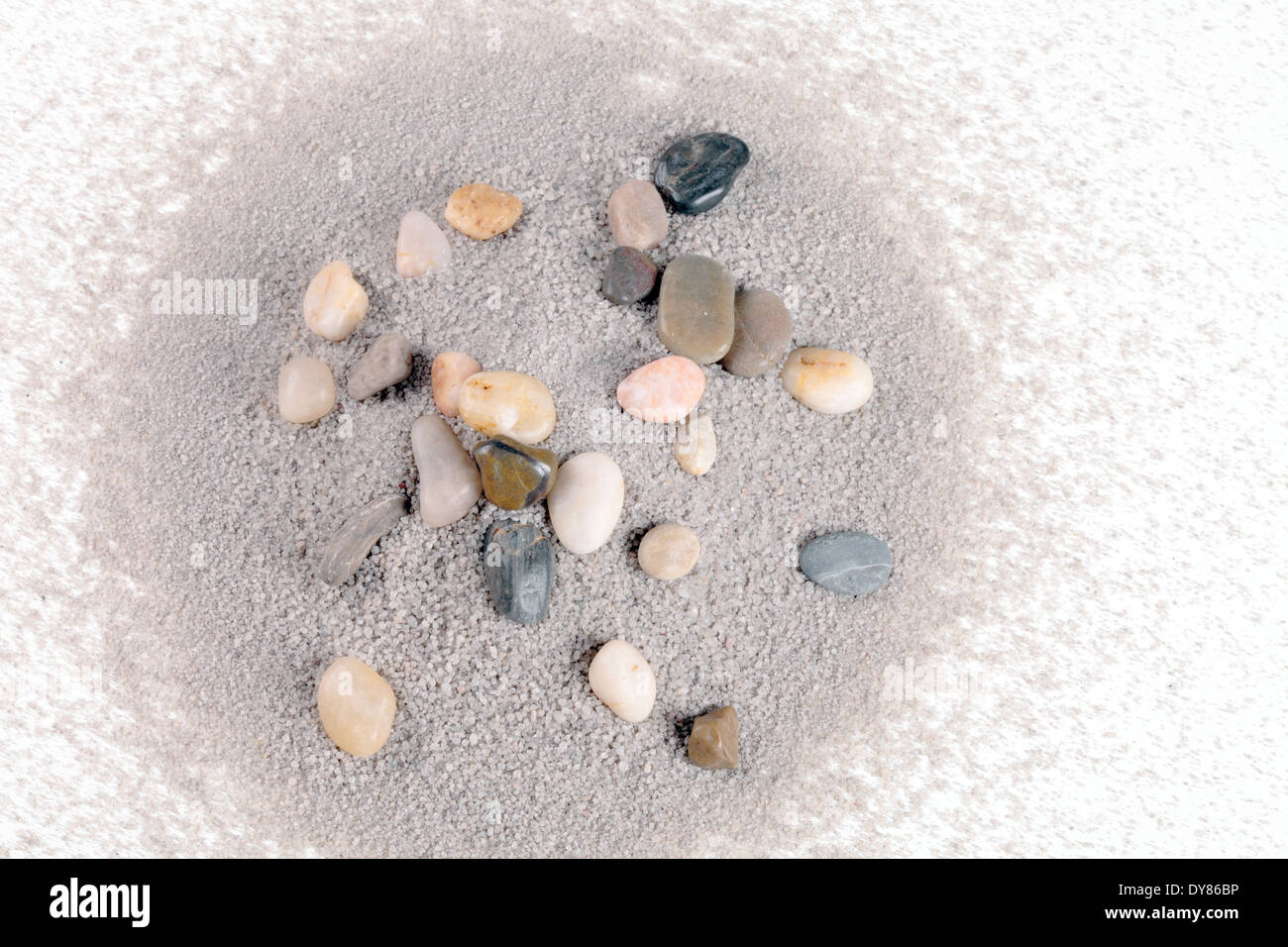 decorative stones buried in sand Stock Photo - Alamy