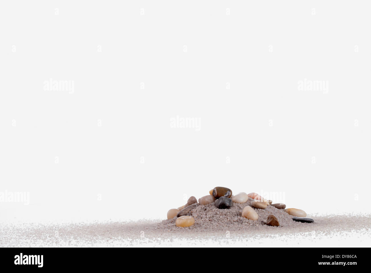 decorative stones buried in sand Stock Photo - Alamy