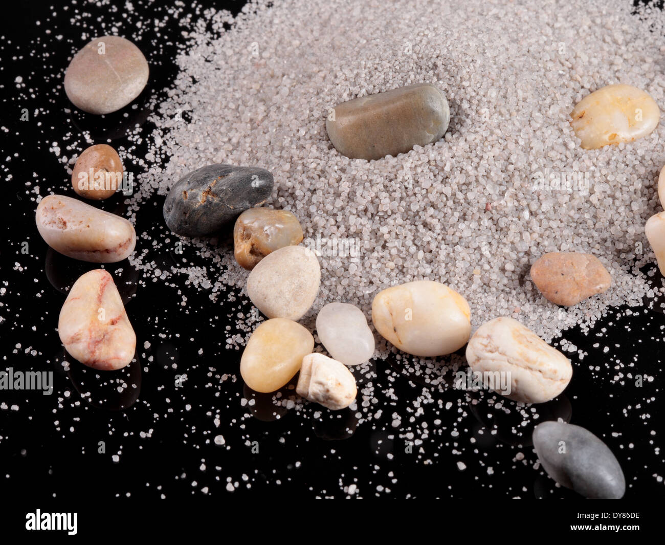 decorative stones buried in sand Stock Photo - Alamy