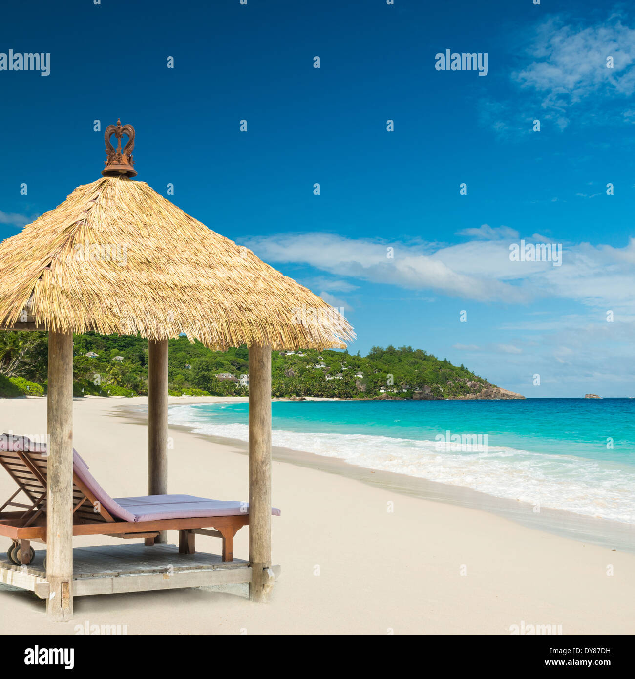 beach beds with roof and turquoise sea Stock Photo - Alamy