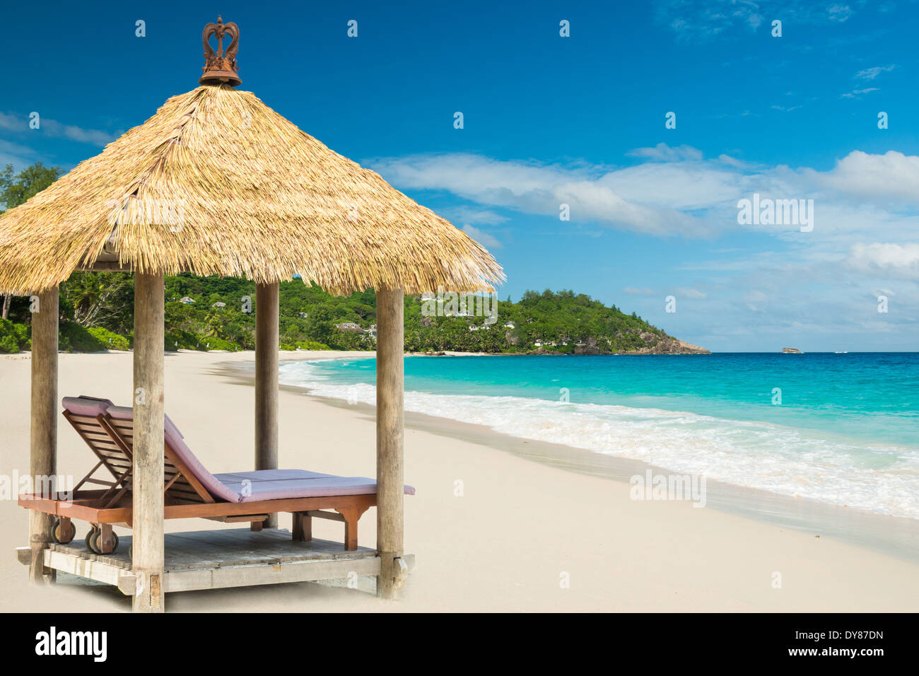 beach beds with roof and turquoise sea Stock Photo - Alamy