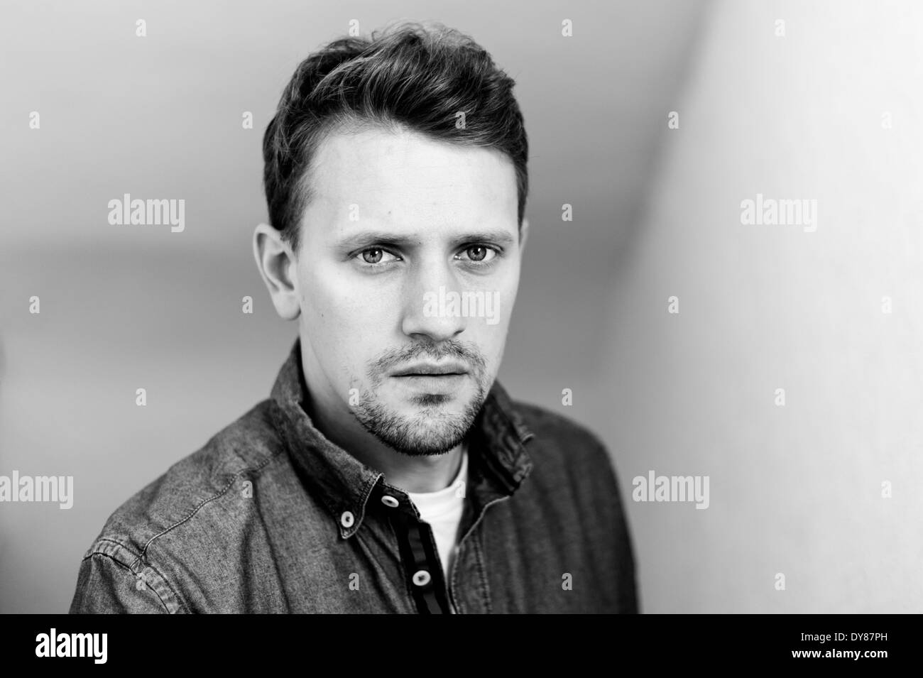 Portrait serious young casual man Black and White Stock Photos & Images ...