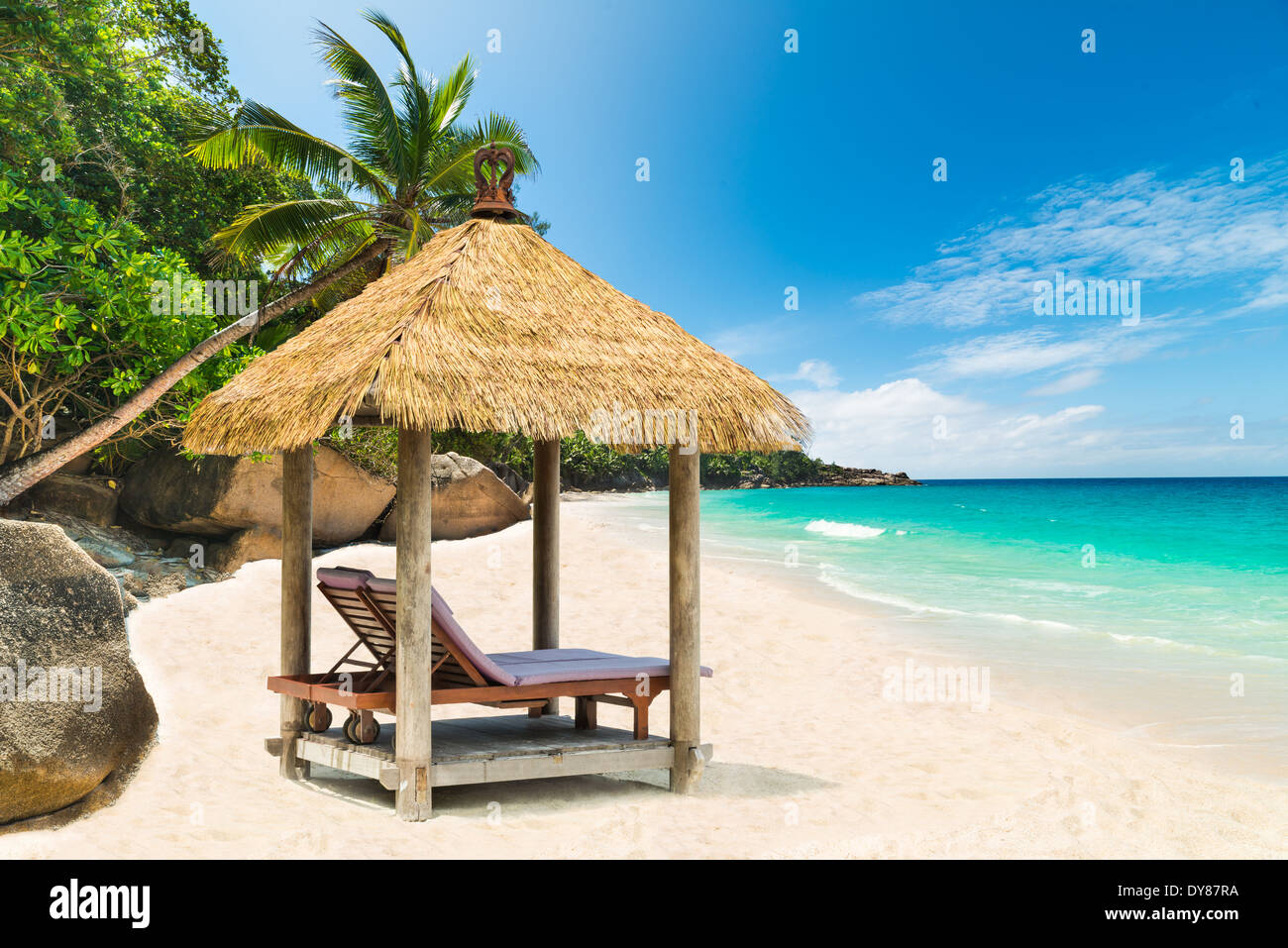 beach beds with roof and turquoise sea Stock Photo - Alamy