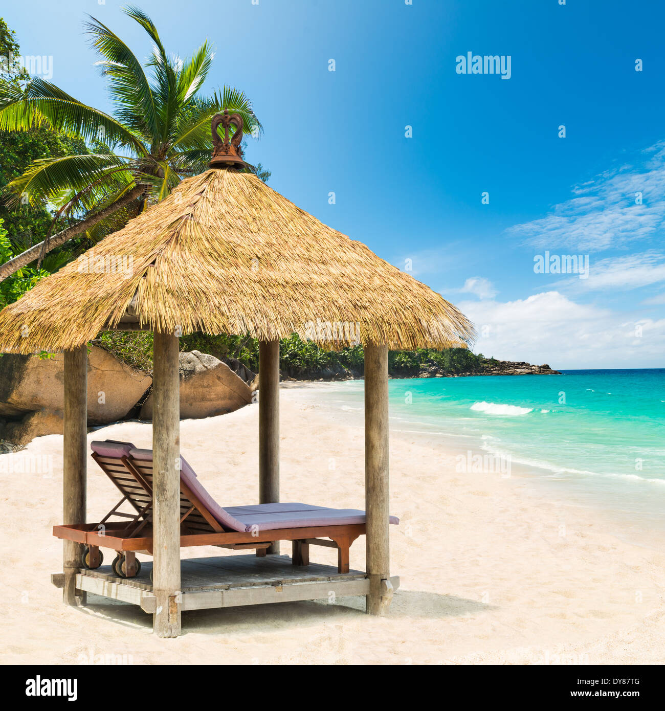 beach beds with roof and turquoise sea Stock Photo - Alamy