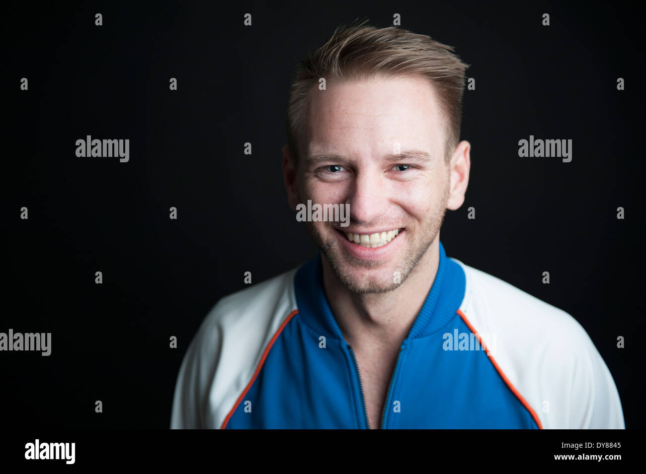 Young man smiling head and shoulders hi-res stock photography and ...