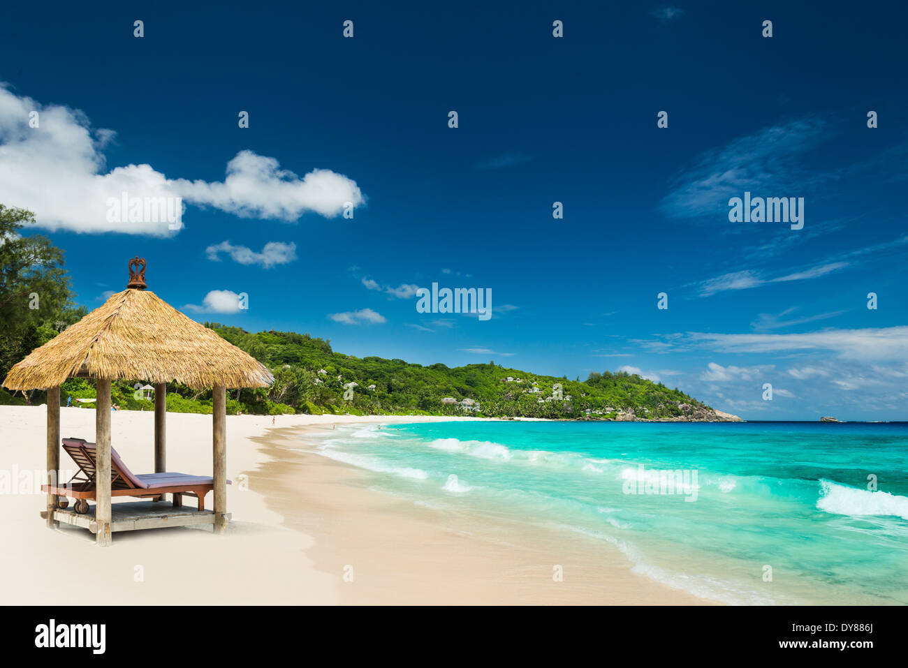 beach beds with roof and turquoise sea Stock Photo - Alamy