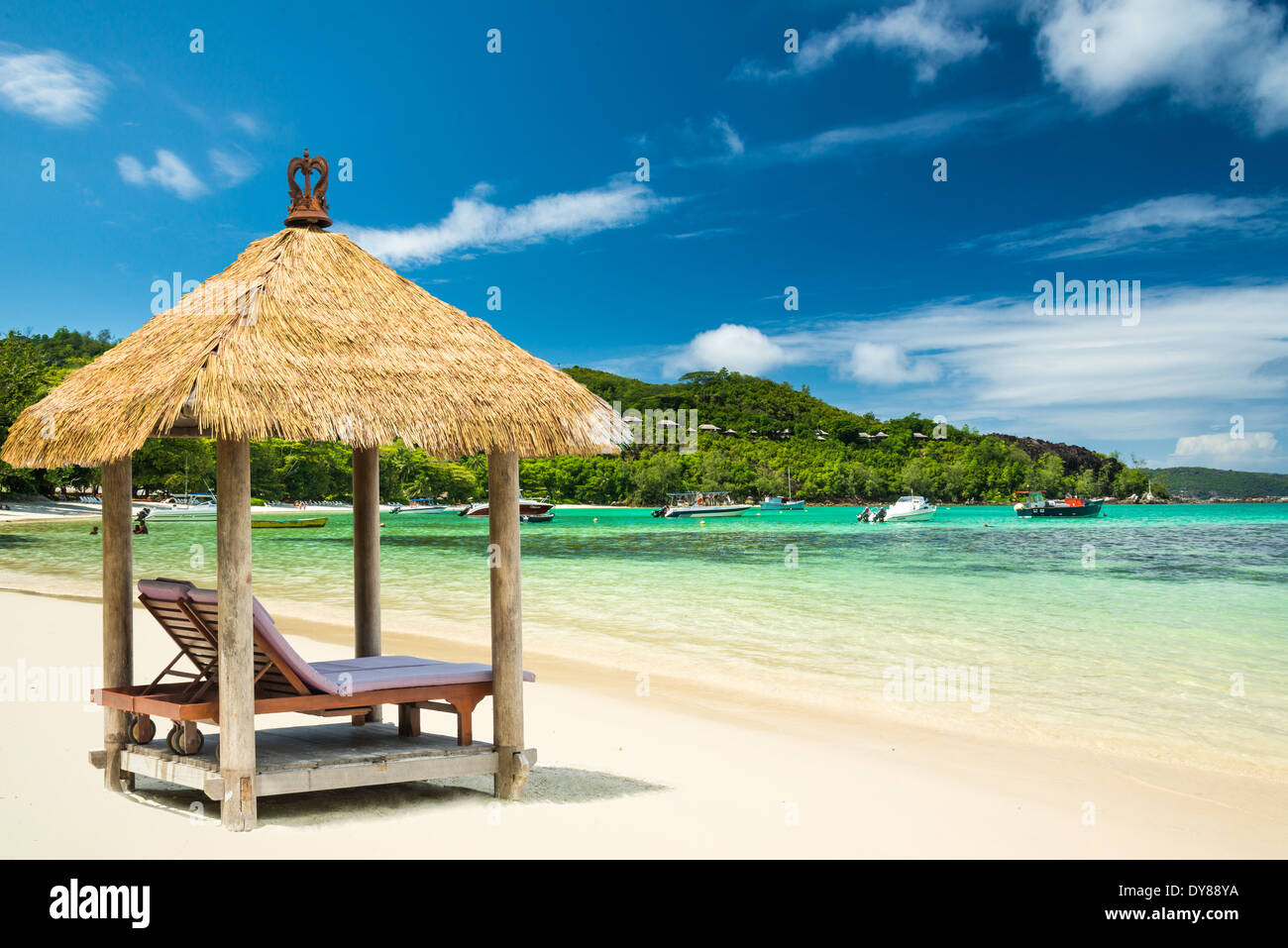 beach beds with roof and turquoise sea Stock Photo - Alamy