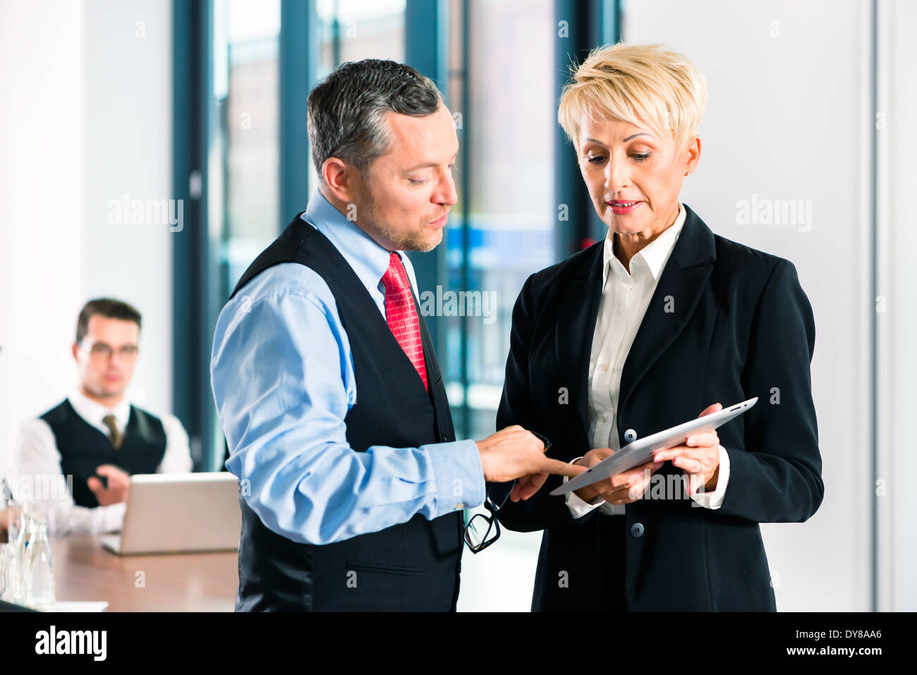 Two colleagues discussing contract hi-res stock photography and images ...