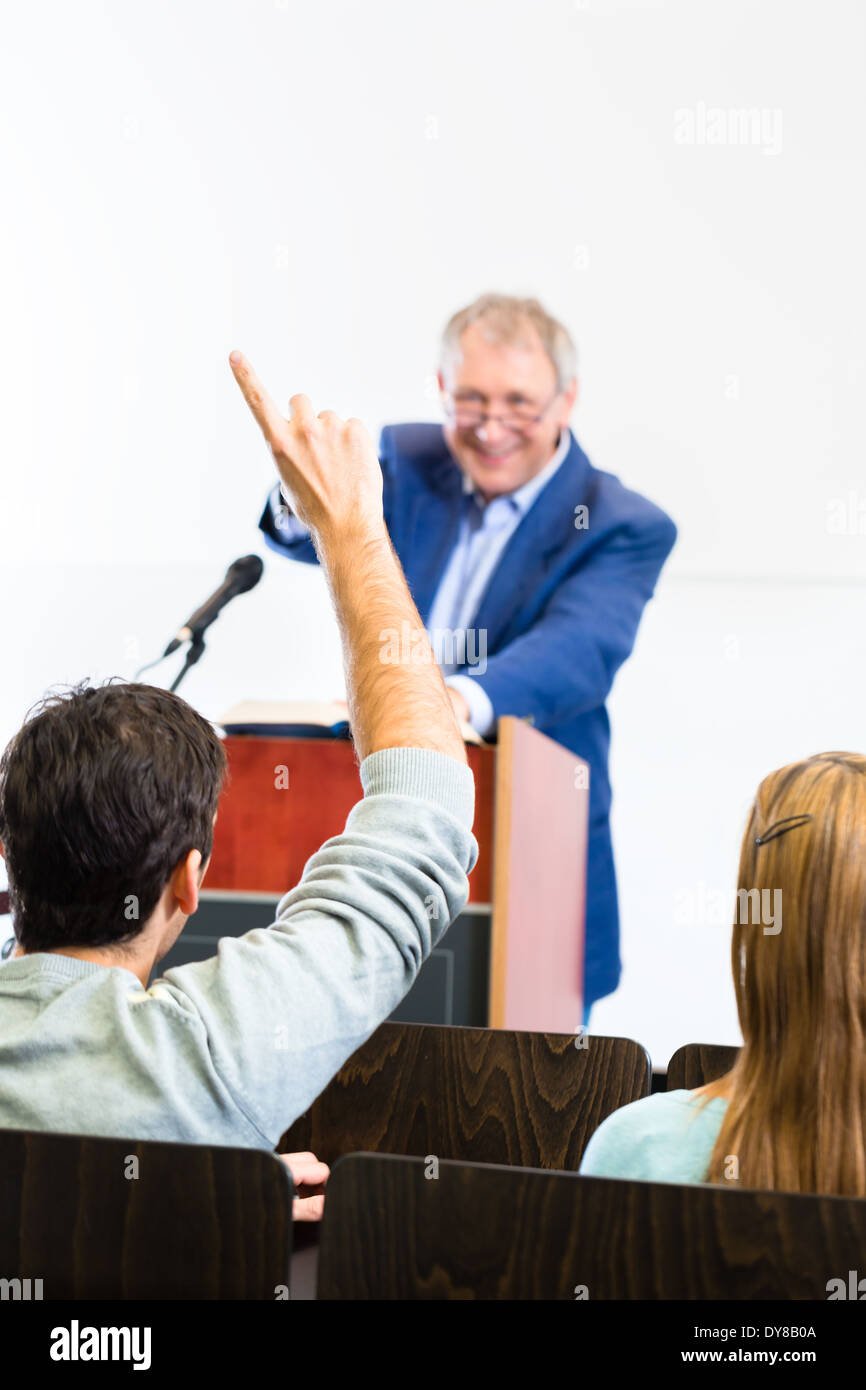 Students listening to college professor giving lecture Stock Photo - Alamy