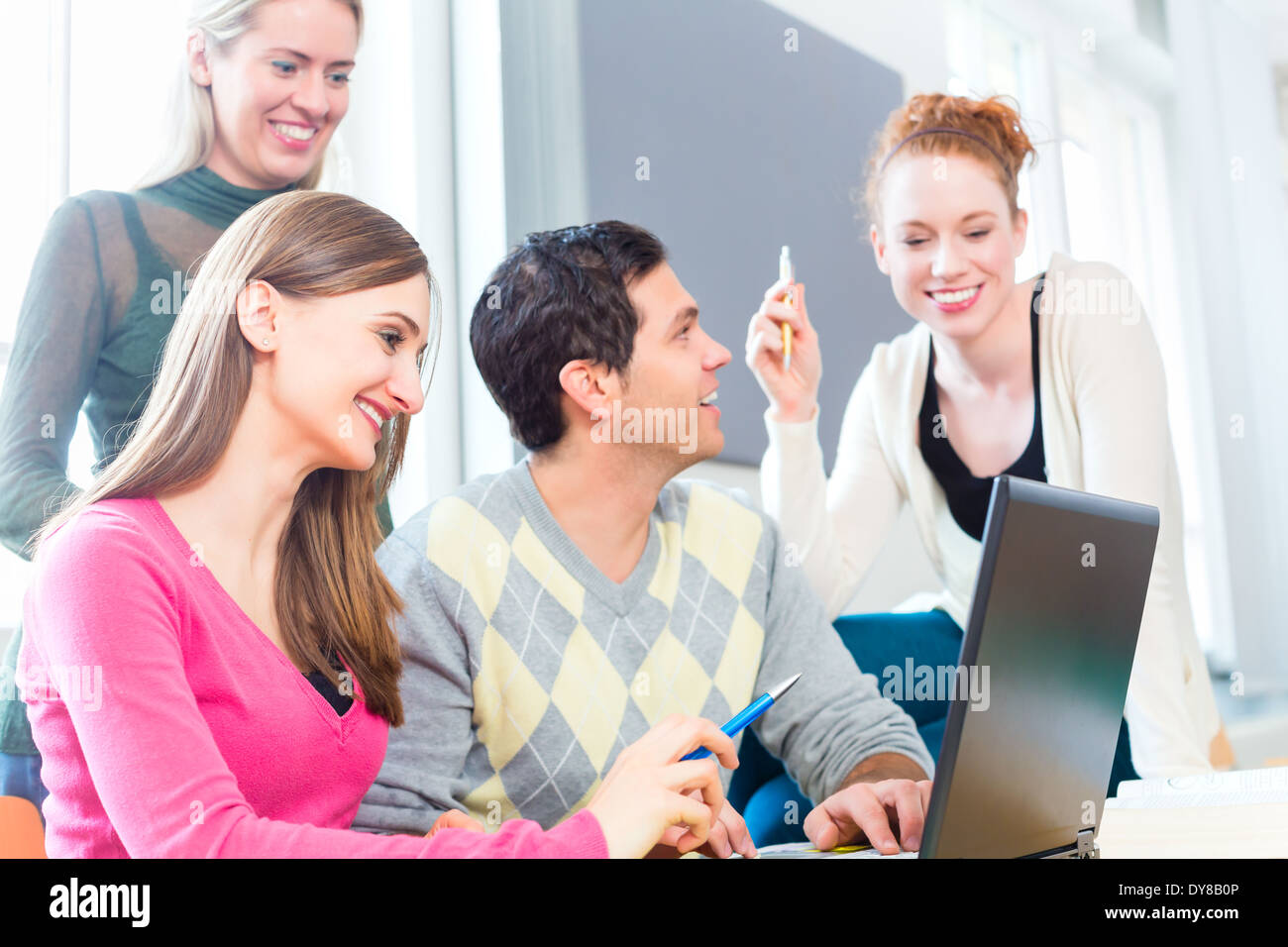 Group of students learning at college with laptop computer Stock Photo ...