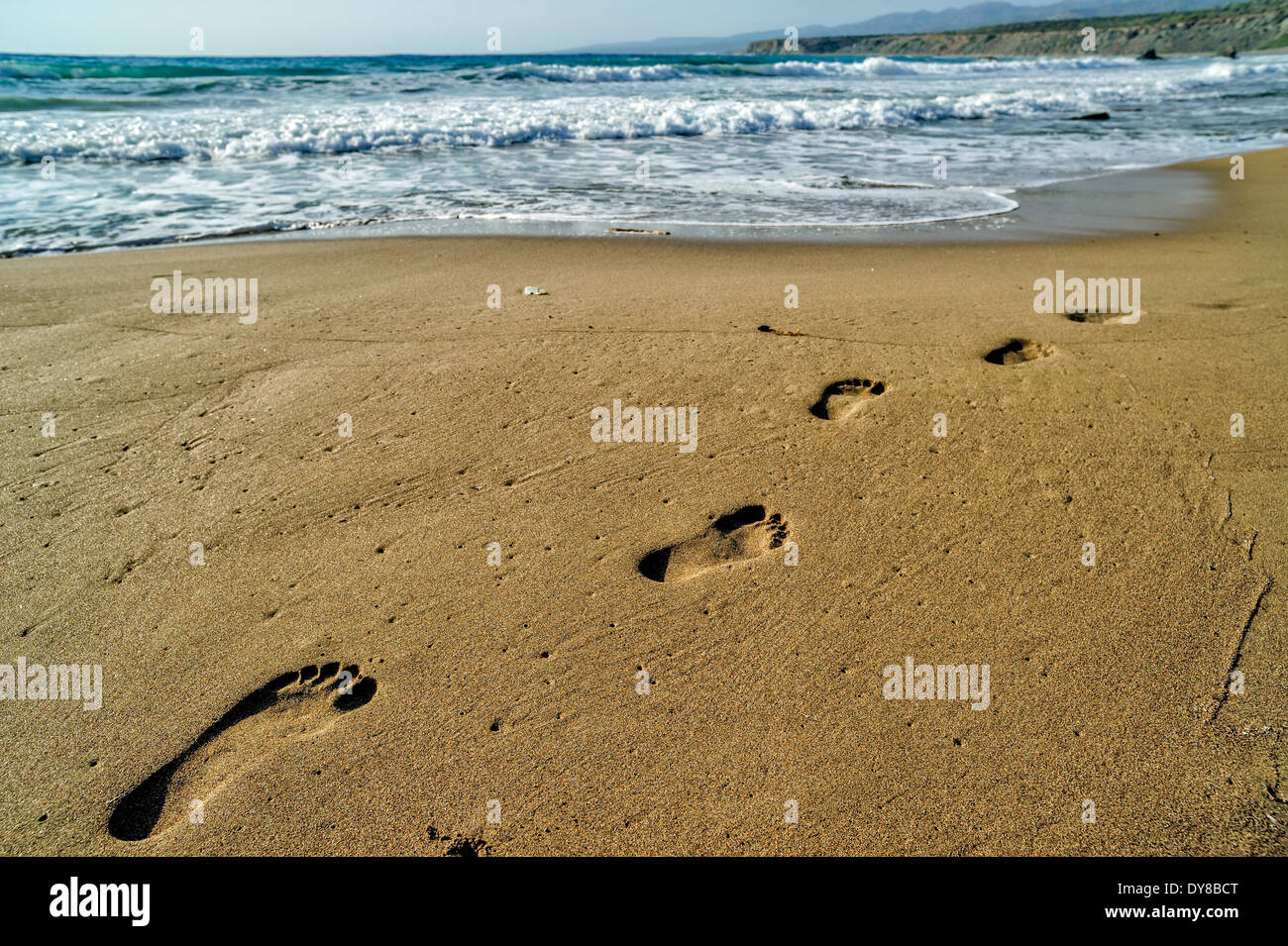 Footsteps on the sand beach Stock Photo - Alamy