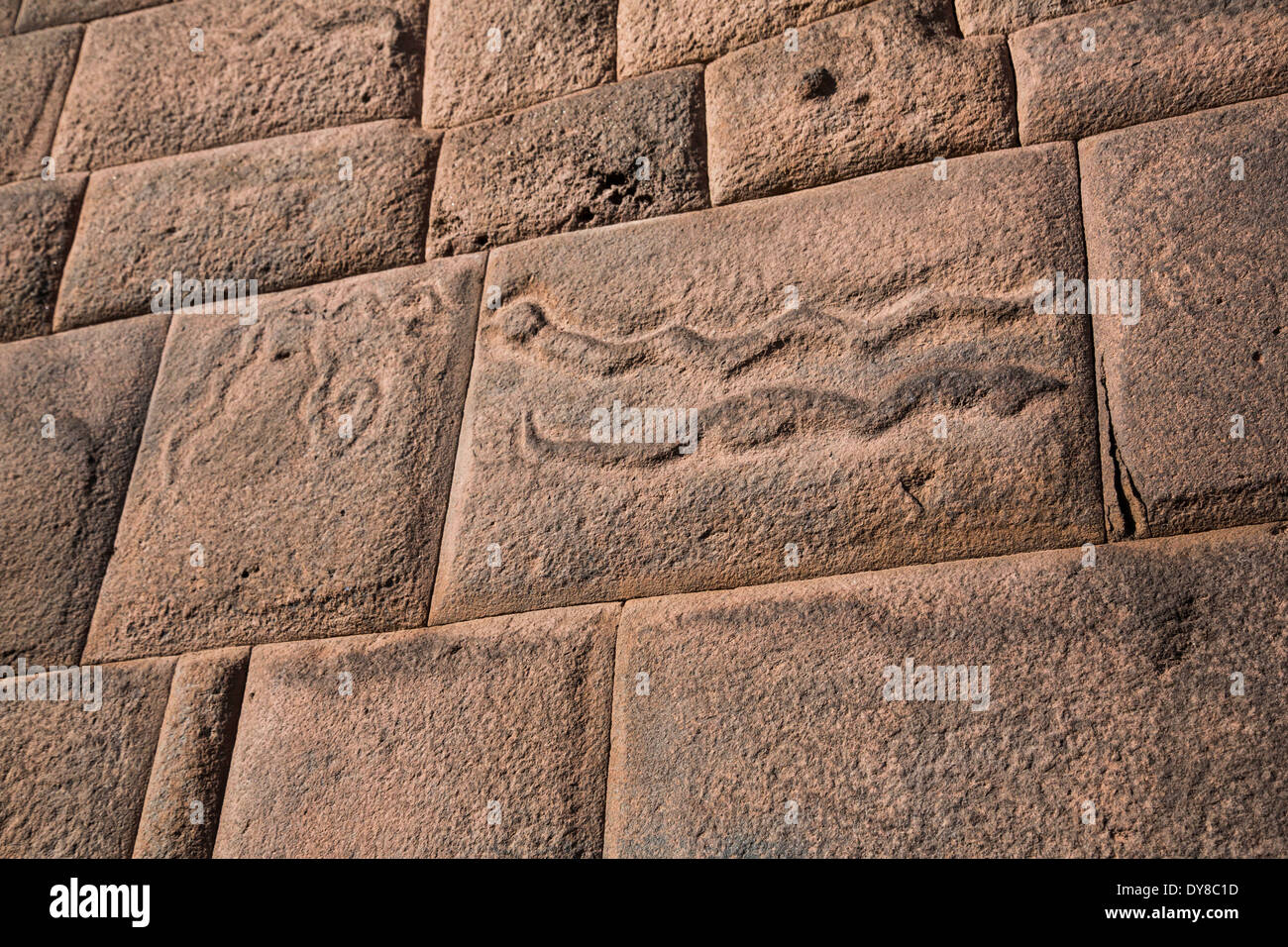 South America, Peru, Cuzco, Plaza de Armas, Snakes carved in Inca stone ...