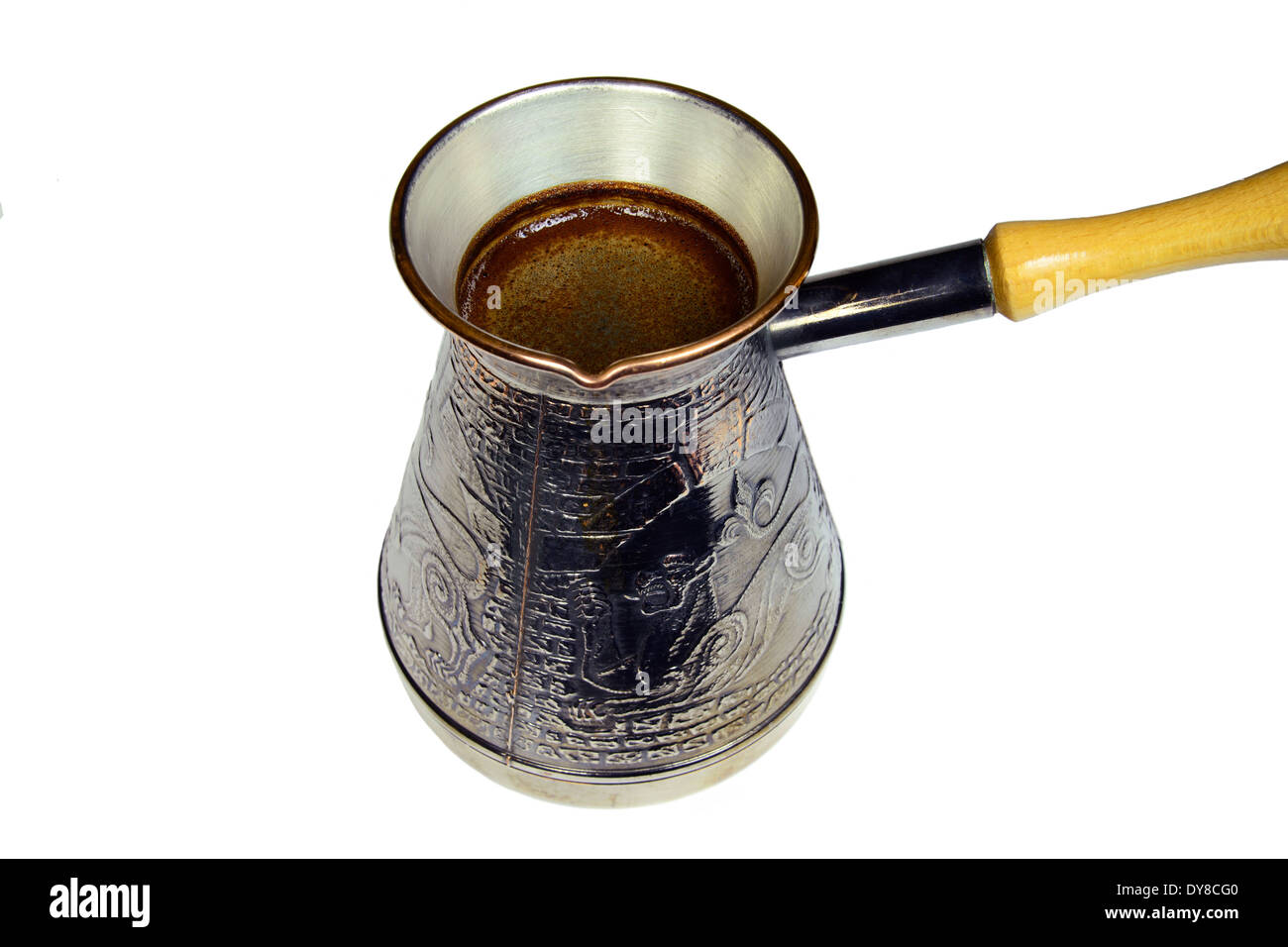 turkish coffee brewing pot isolated on white Stock Photo - Alamy