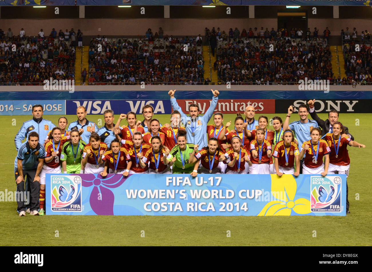 Spain squad in National Stadium pitch, posing with second place medals ...