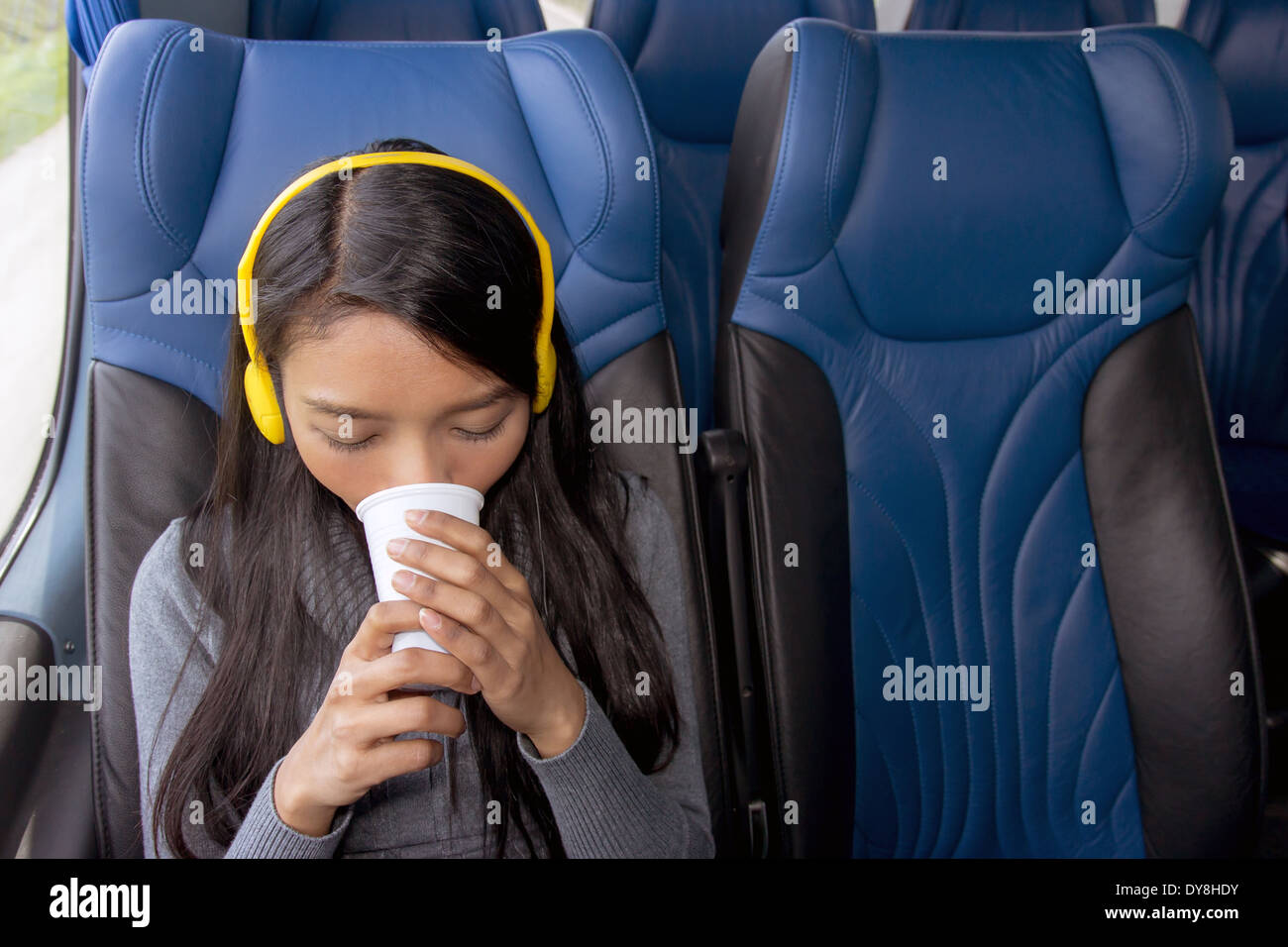 Woman riding in a bus Stock Photo - Alamy