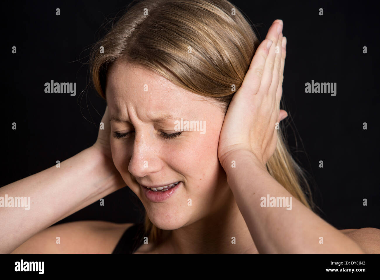 Young woman has an earache Stock Photo - Alamy