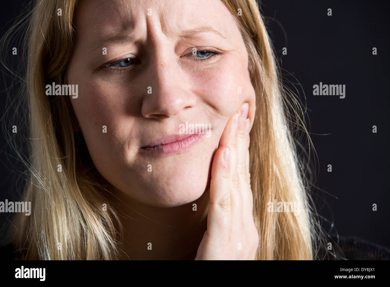 Young woman having toothache Stock Photo - Alamy