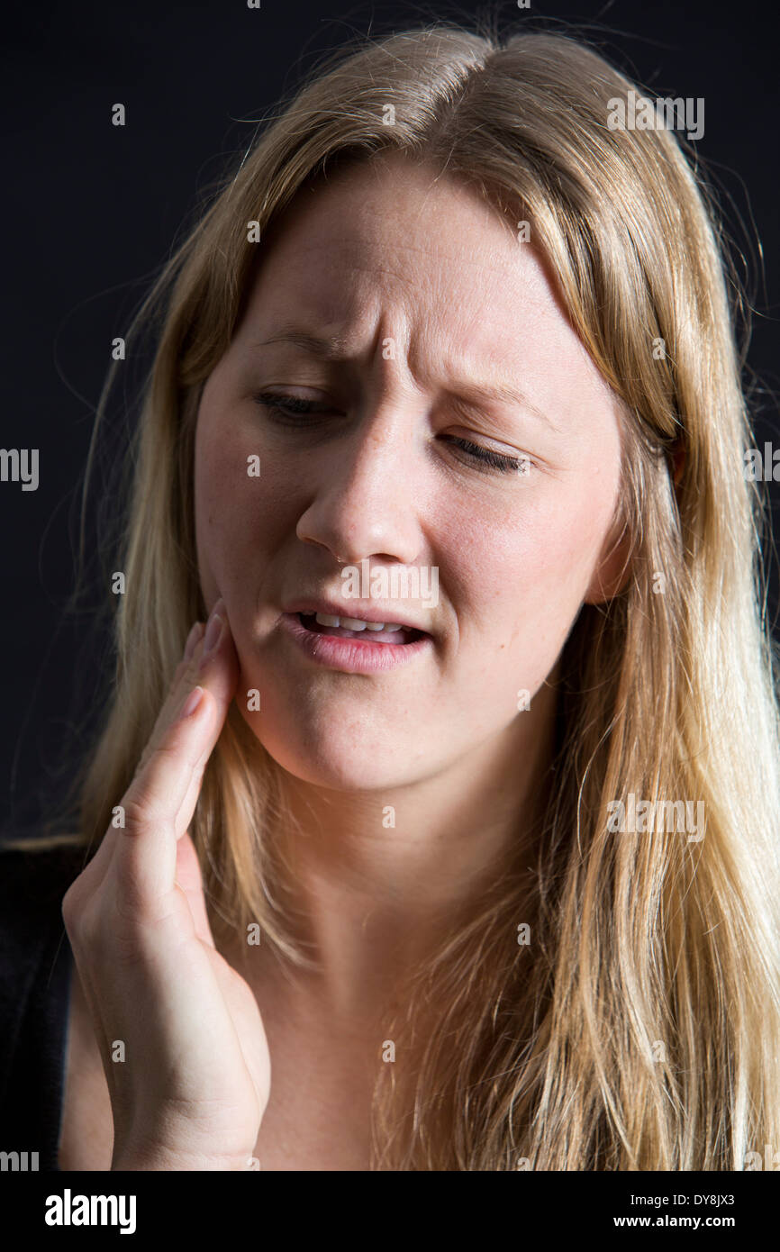 Young woman having toothache Stock Photo - Alamy