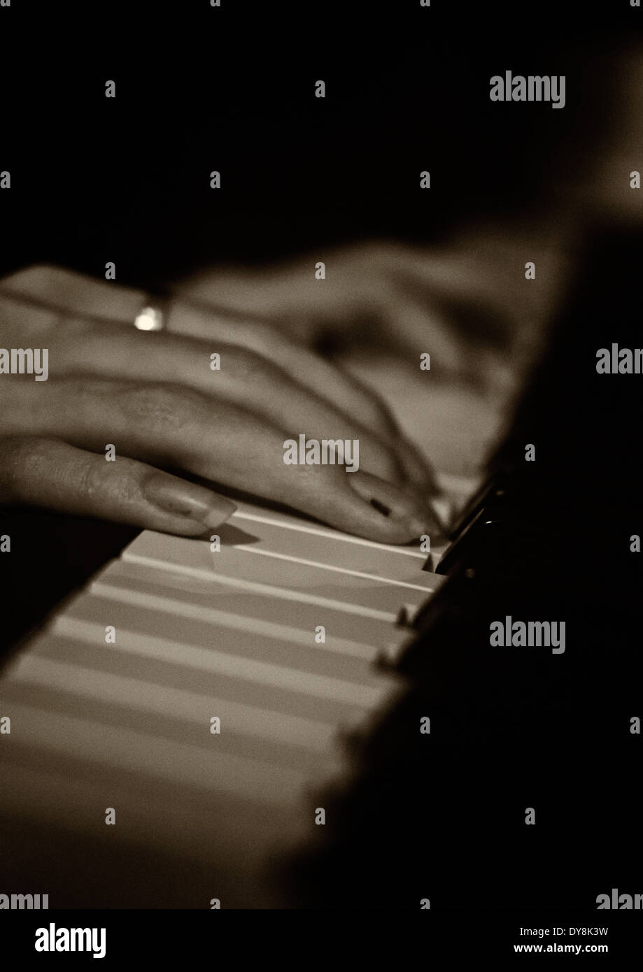 Fingers on the piano keys Stock Photo - Alamy