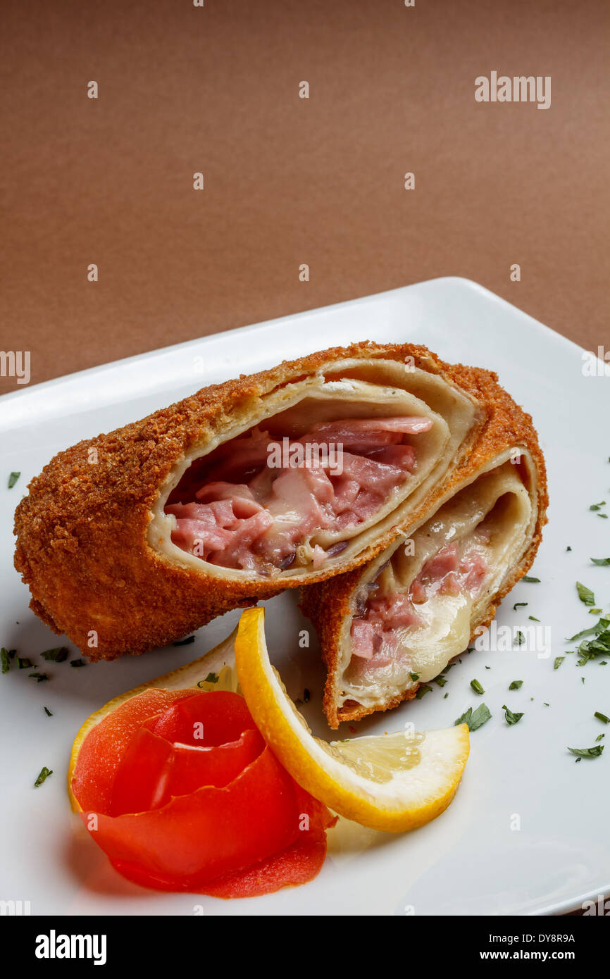 Fried crepes with ham and cheese Stock Photo - Alamy