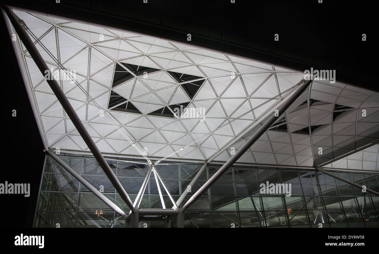 Architectural detail illuminated by lights at night, Stansted airport ...