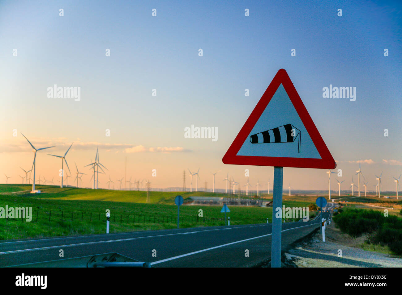 Wind turbines beside road sign Stock Photo - Alamy