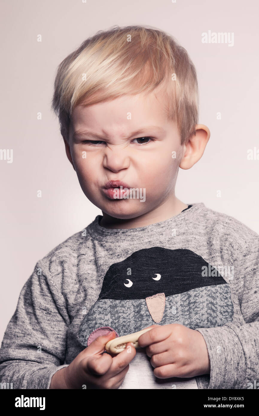 Portrait of little boy pouting a mouth Stock Photo - Alamy
