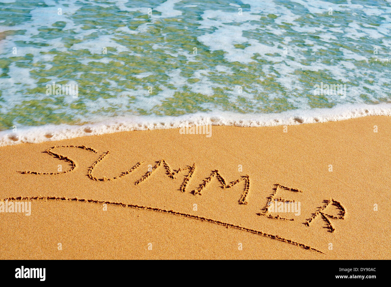 Summer written in the sand hi-res stock photography and images - Alamy