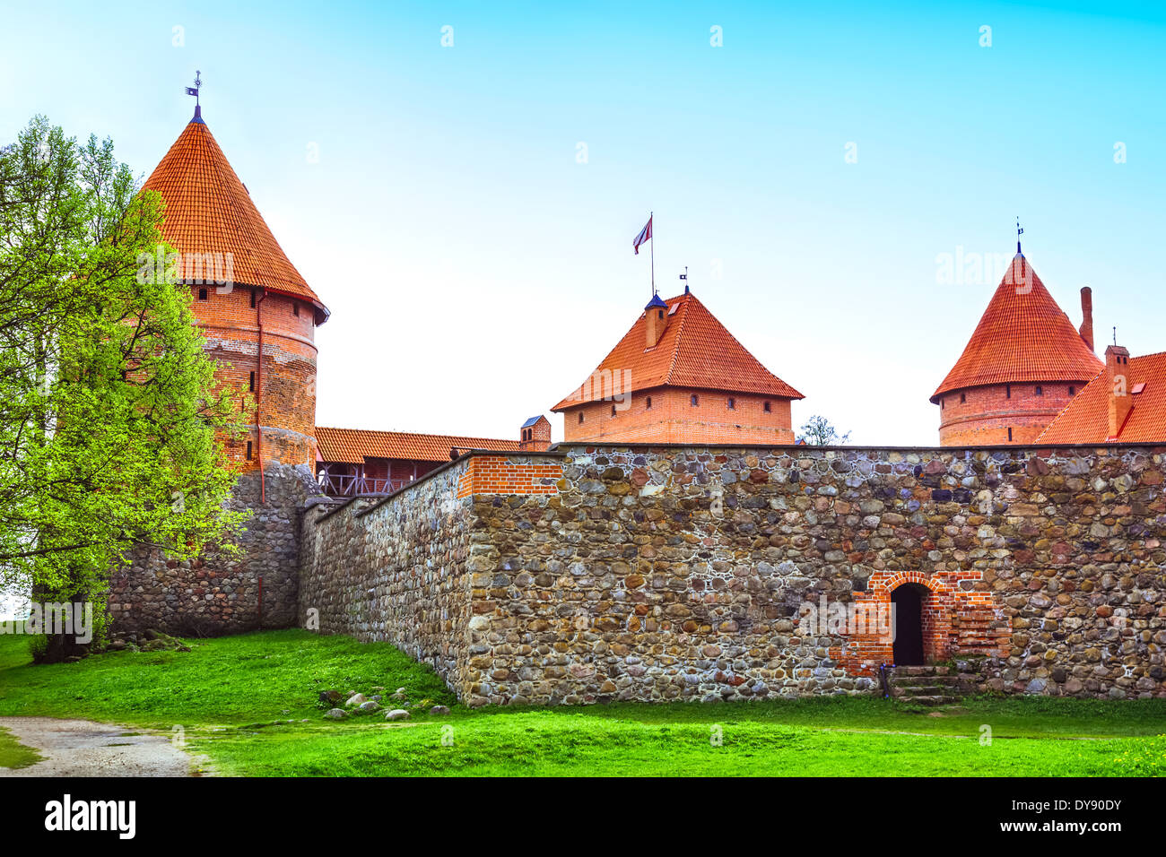 Red brick towers and stone wall of castle in Trakai, Lithuania Stock ...