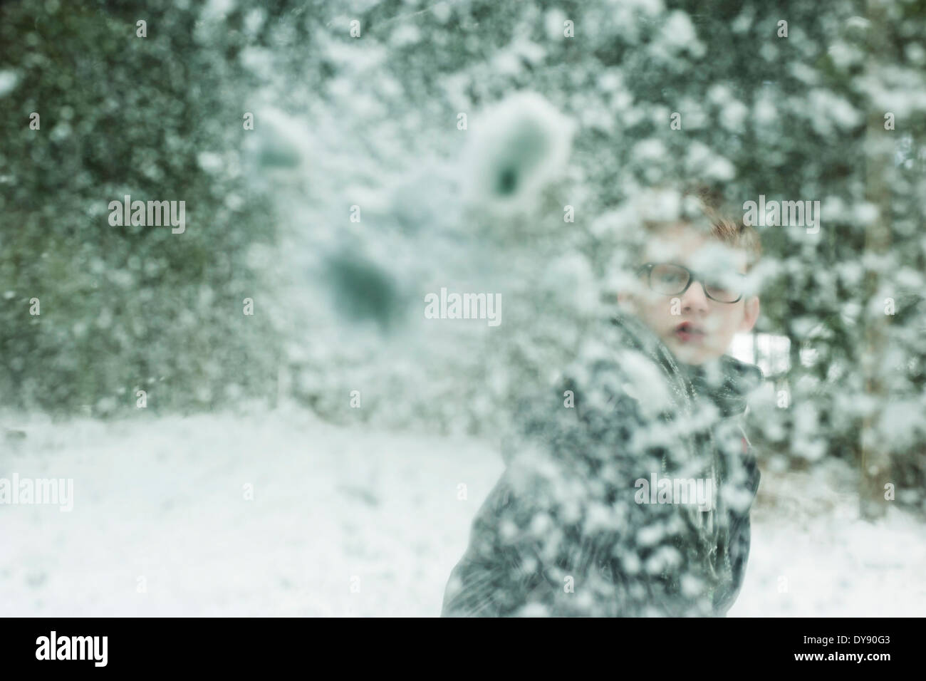 Boy throwing snowball hi-res stock photography and images - Alamy