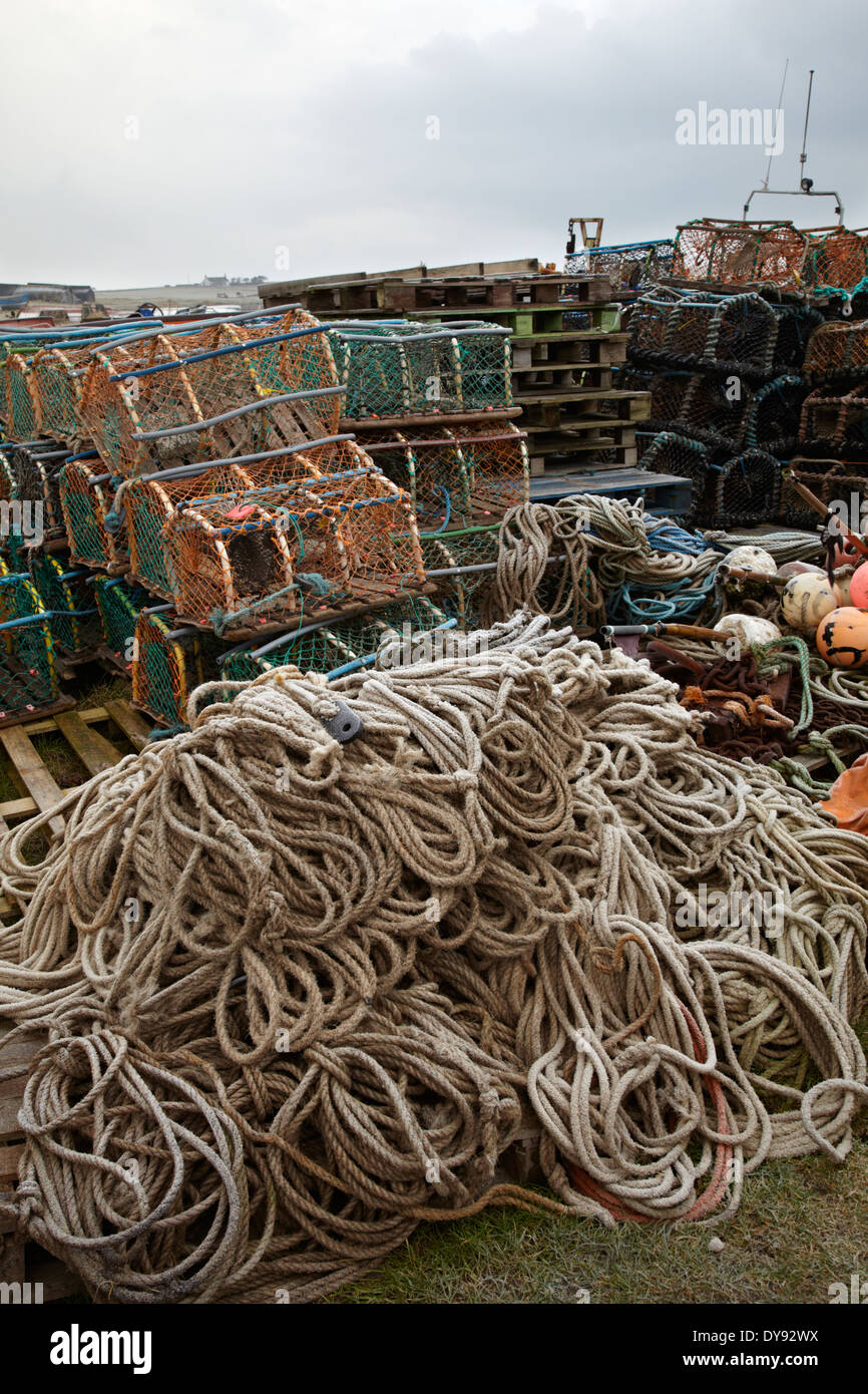 Lobster pots and coiled rope at Lindisfarne, Holy Island Stock Photo ...