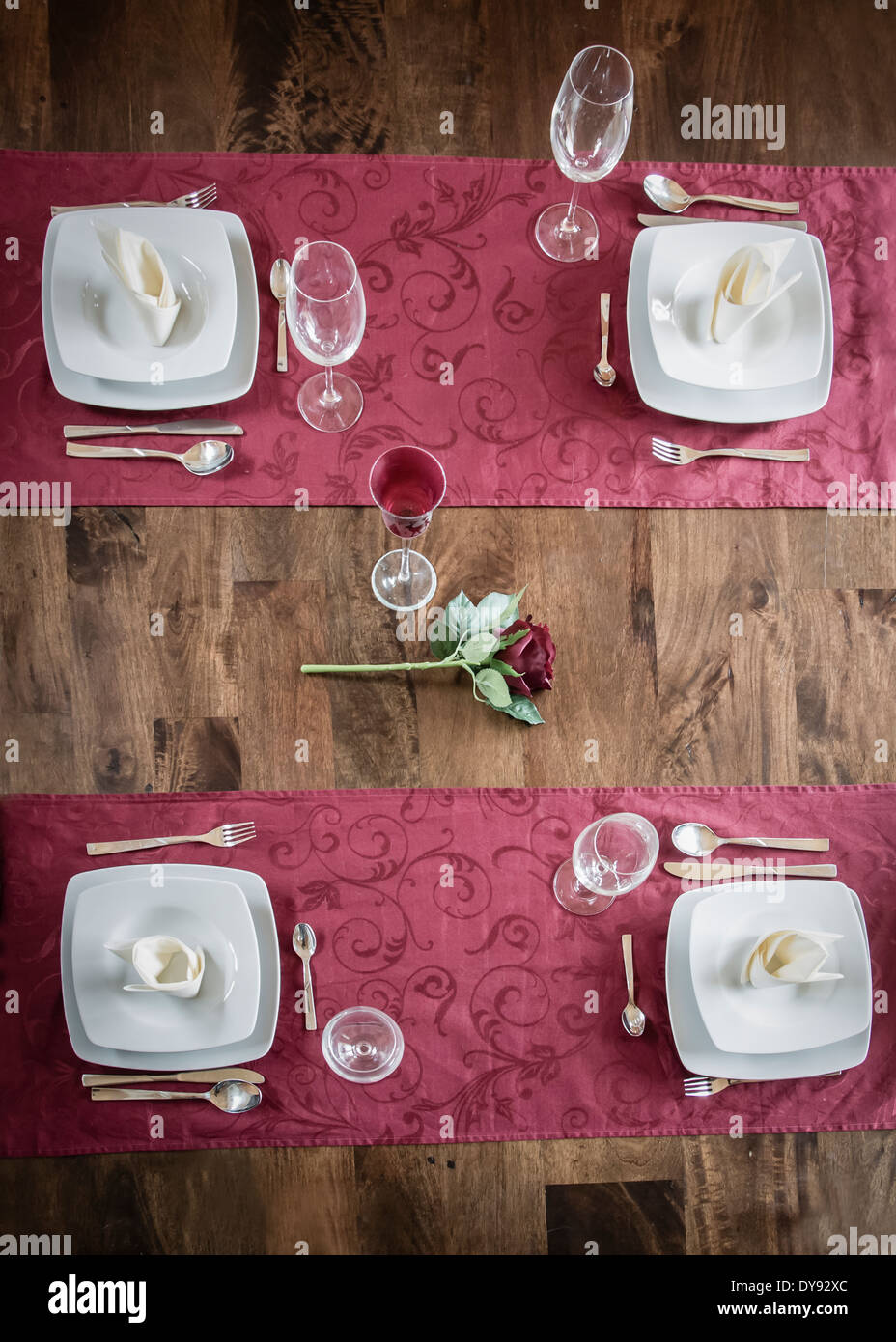 Festive laid table for four persons, elevated view Stock Photo - Alamy