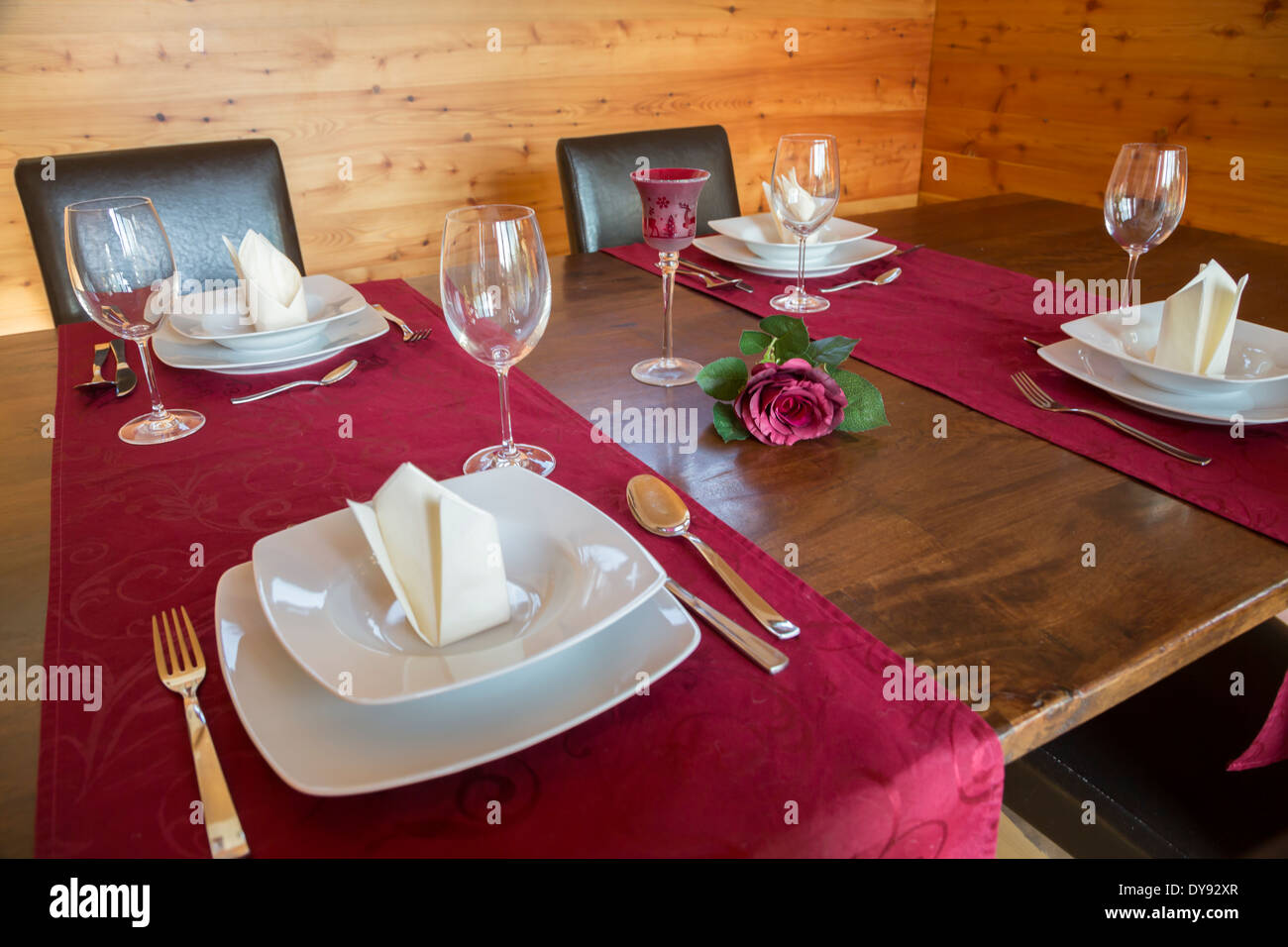 Festive laid table for four persons Stock Photo - Alamy