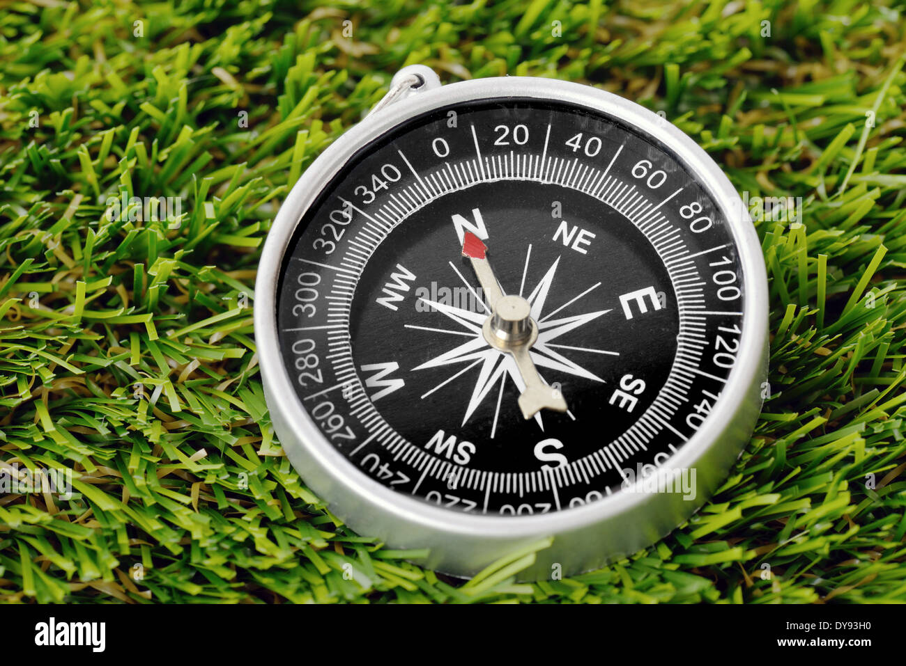 a compass sat on green grass Stock Photo - Alamy