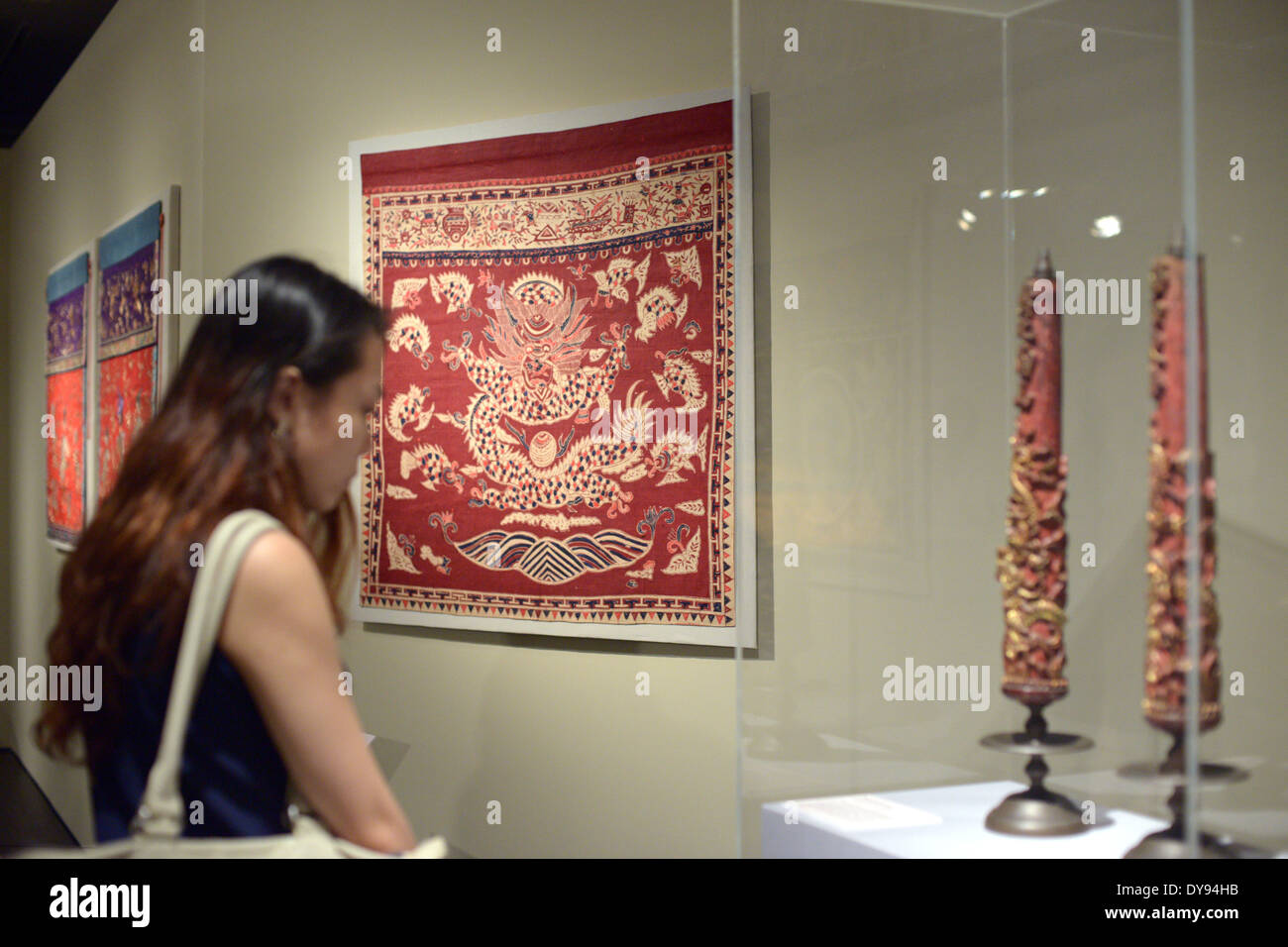 Singapore. 10th Apr, 2014. A journalist views items on display during ...