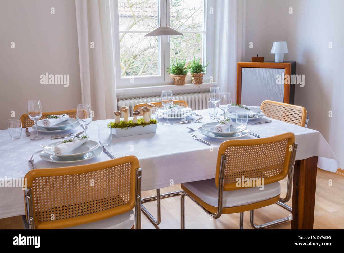 Dining room with festive laid table Stock Photo - Alamy