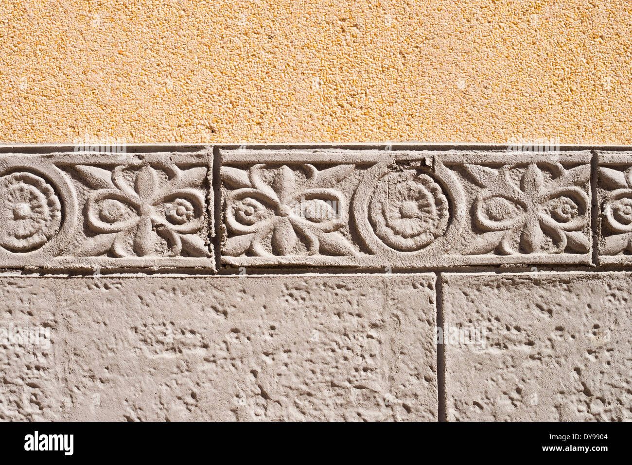 Ornamental wall cladding using granite bricks with floral motives Stock ...