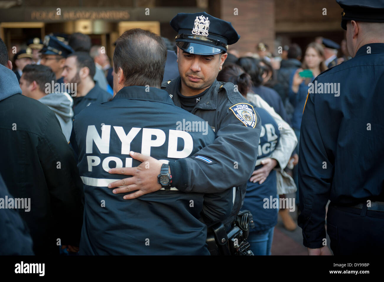 Manhattan, New York, USA. 9th Apr, 2014. Police officers embrace as ...