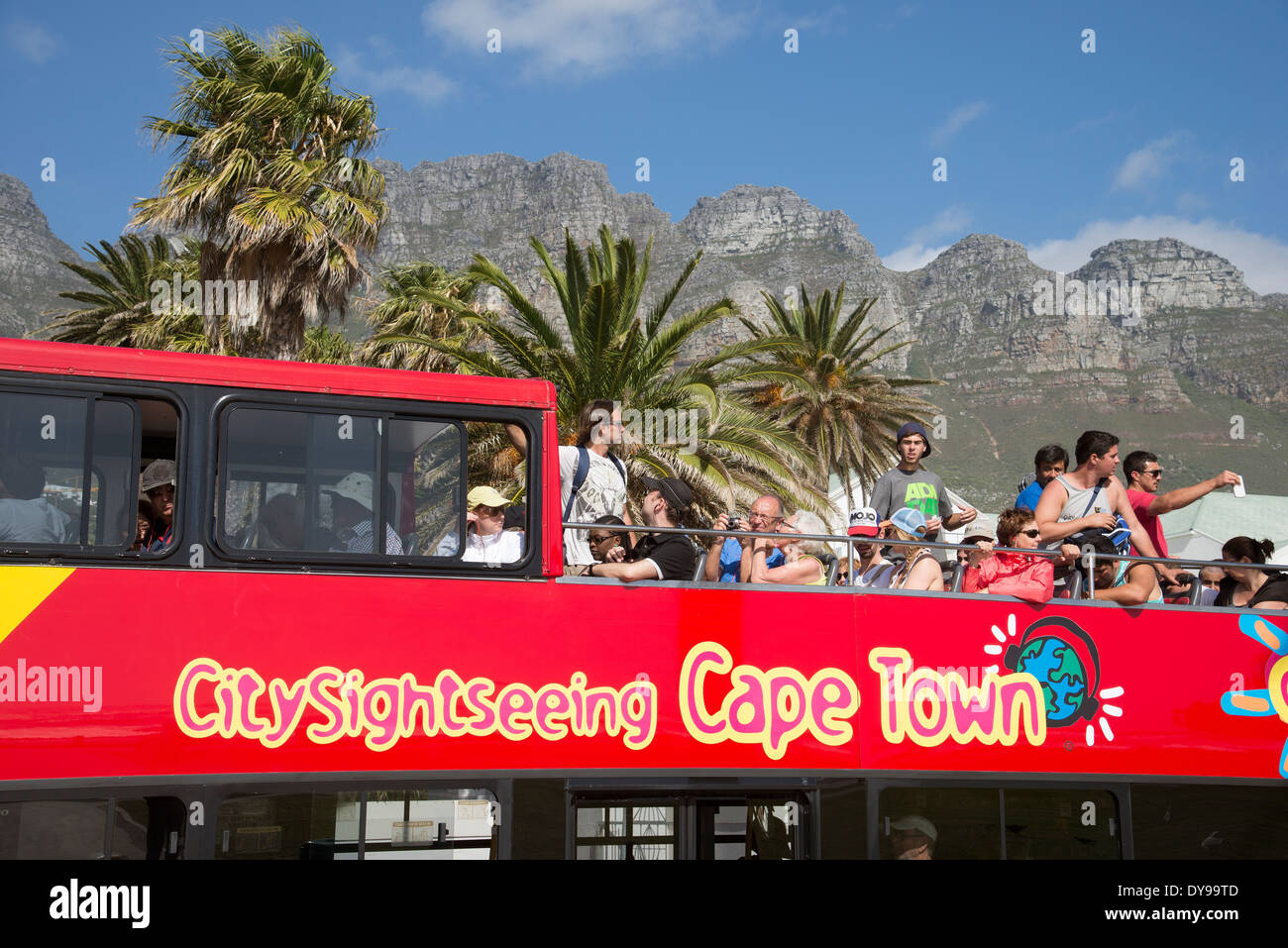Hop on hop off tour bus with sightseeing tourists at Camps Bay near ...
