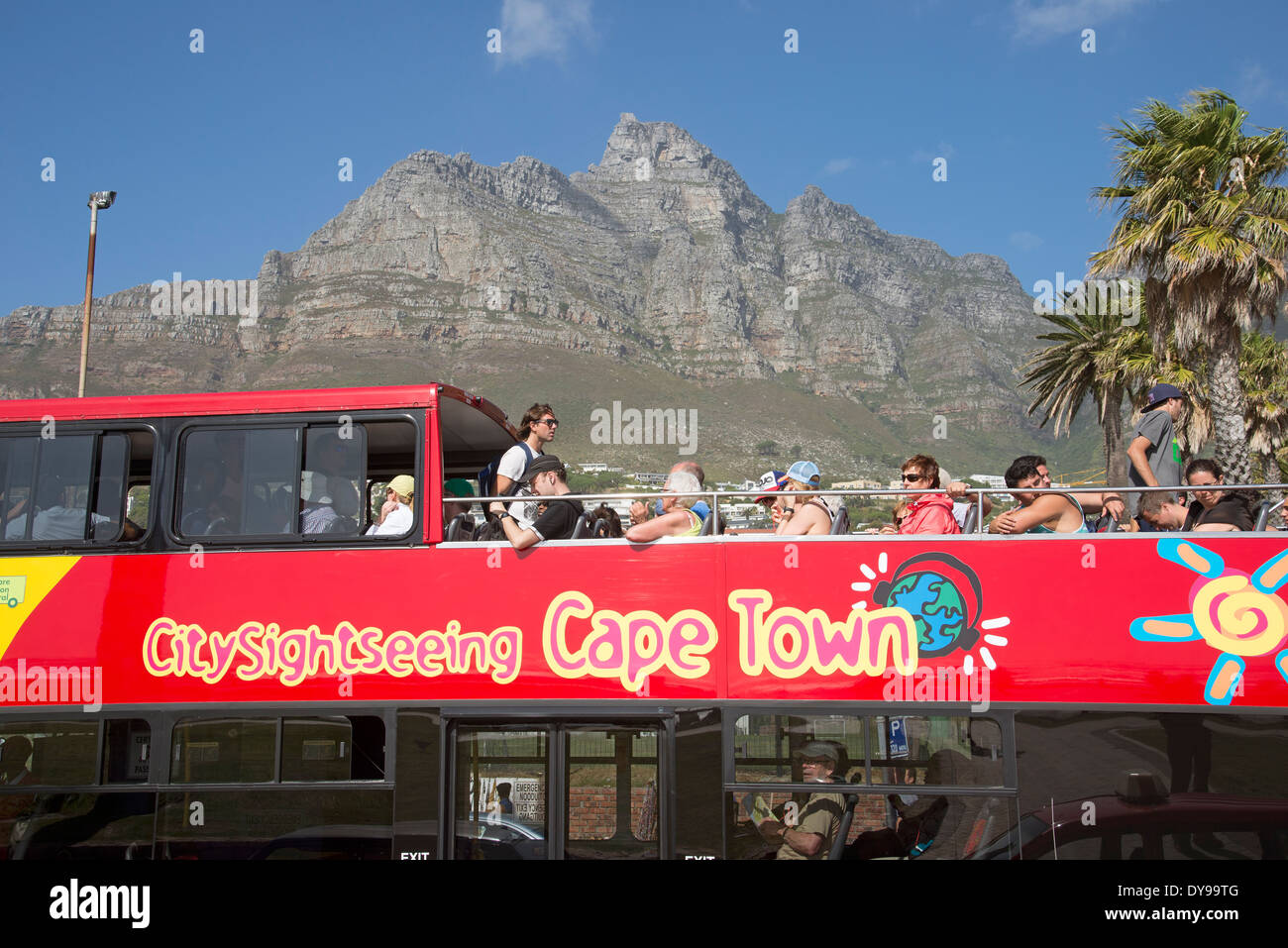 Hop on hop off tour bus with sightseeing tourists at Camps Bay near ...