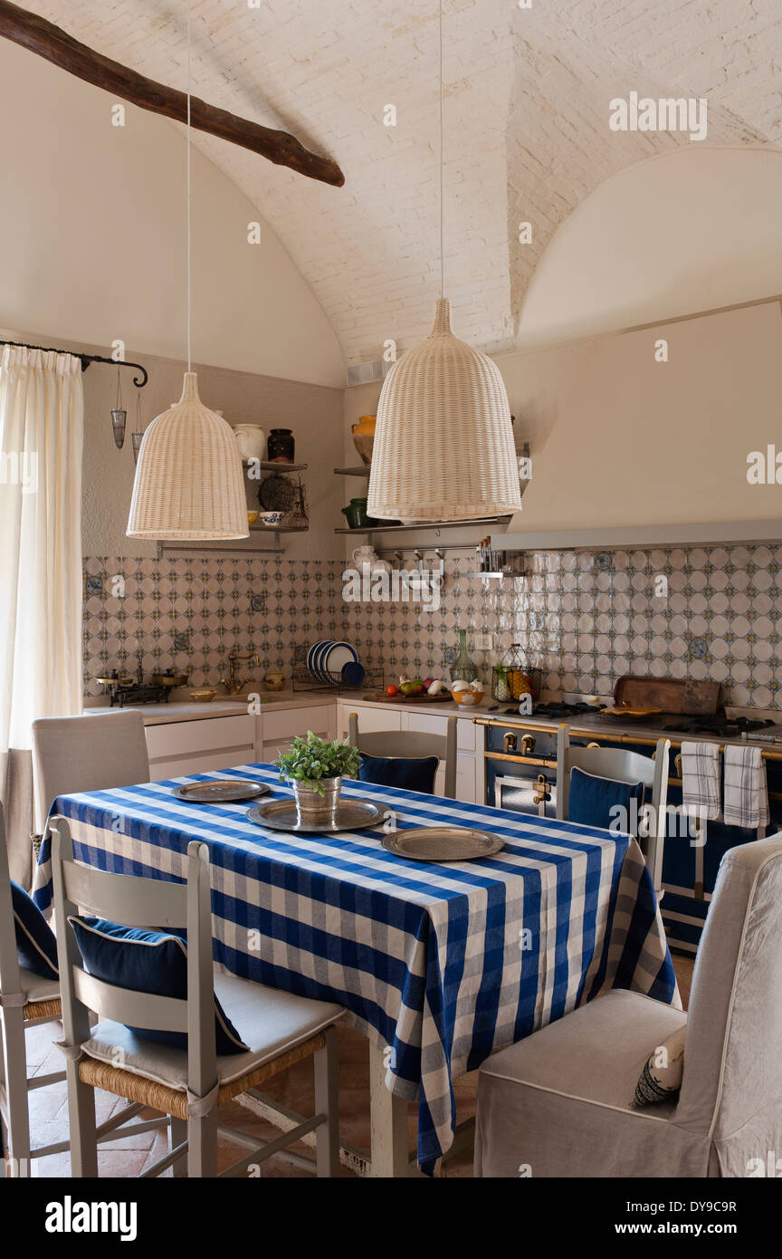 Rustic country kitchen with decorative tiling, La Cornue range cooker ...