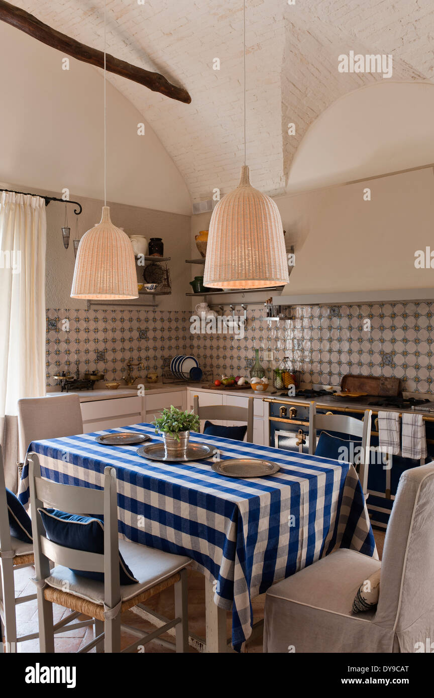 Rustic country kitchen with decorative tiling, La Cornue range cooker ...