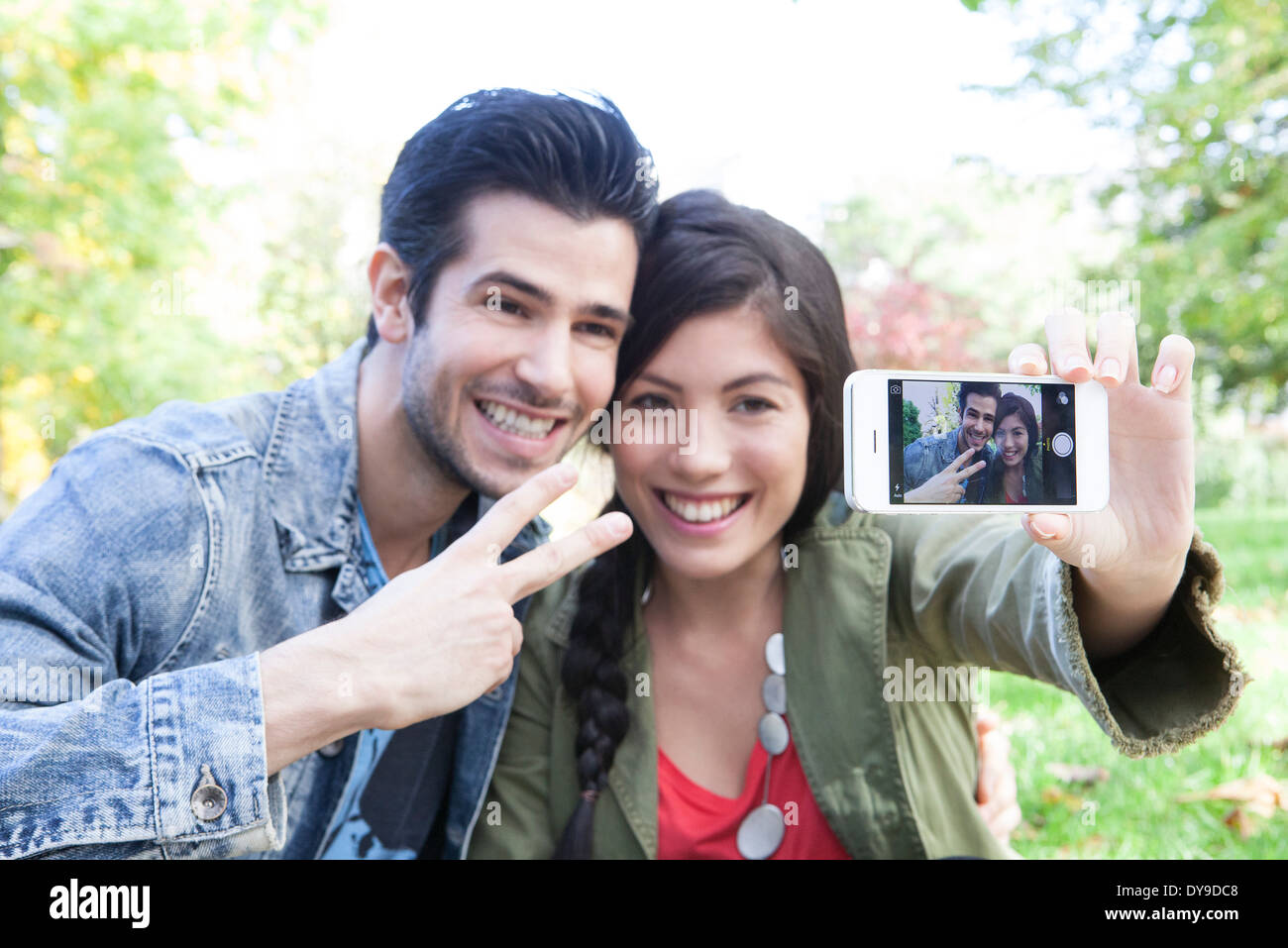 Couple taking self-portrait Stock Photo - Alamy