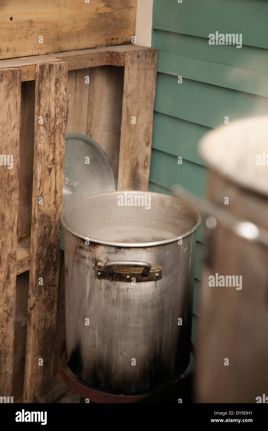 A homemade setup for boiling maple sap to make maple syrup, a common ...