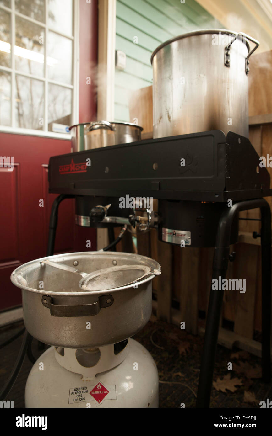 A homemade setup for boiling maple sap to make maple syrup, a common ...