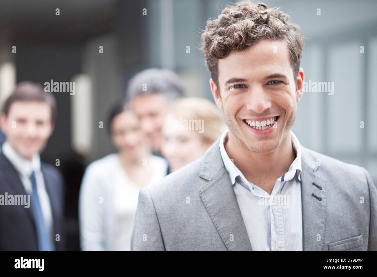 Businessman looking up in crowd hi-res stock photography and images - Alamy