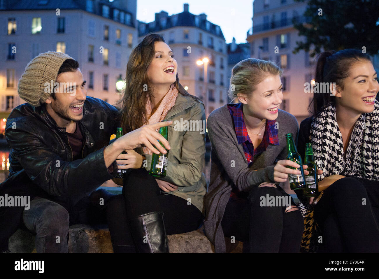 Friends having beers together outdoors Stock Photo - Alamy