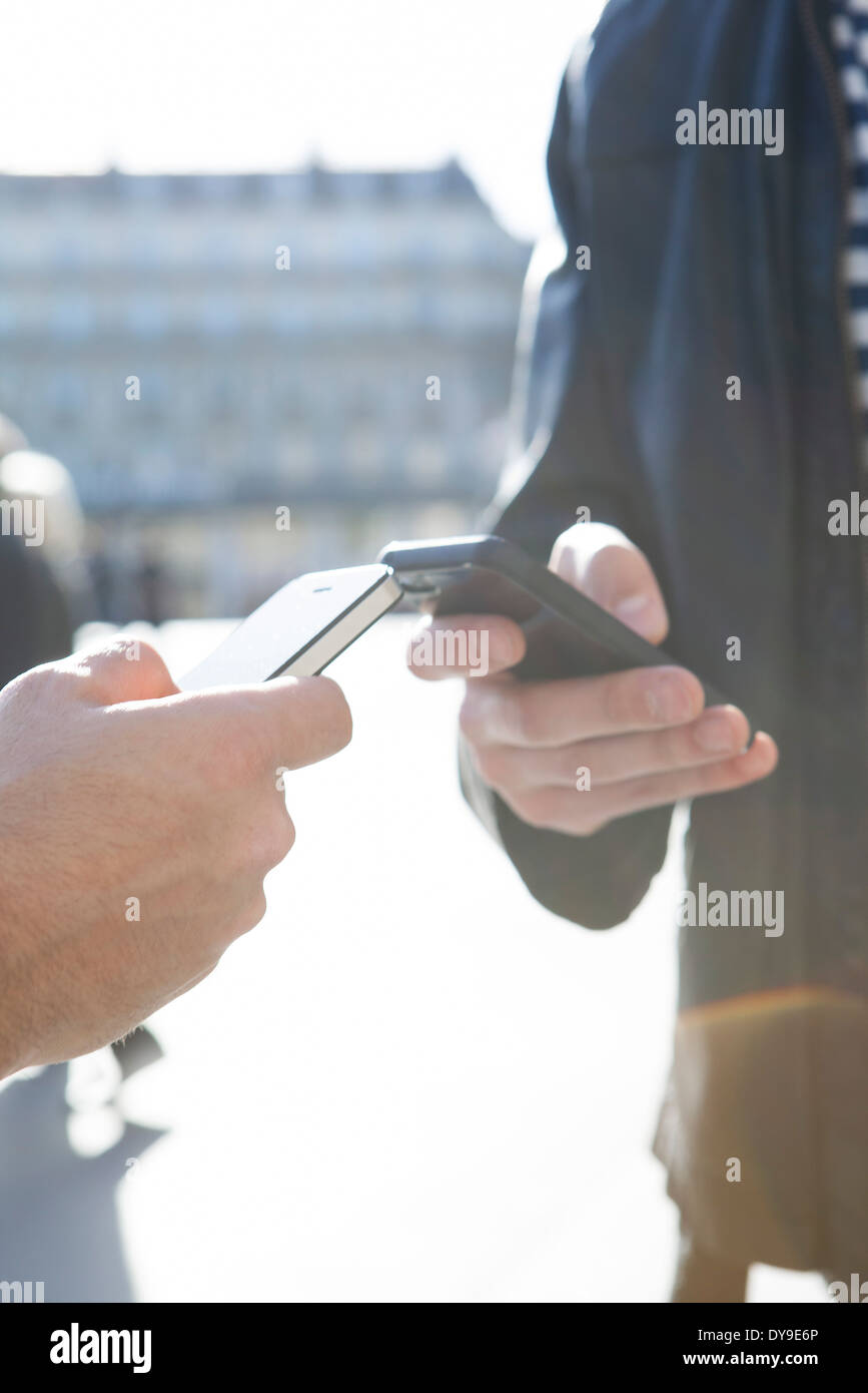 Wirelessly sharing data between smartphones Stock Photo - Alamy